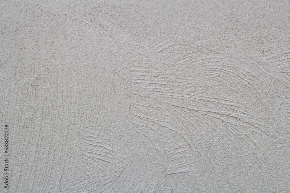 Texture of plaster cement wall is uneven and still wet for background ...