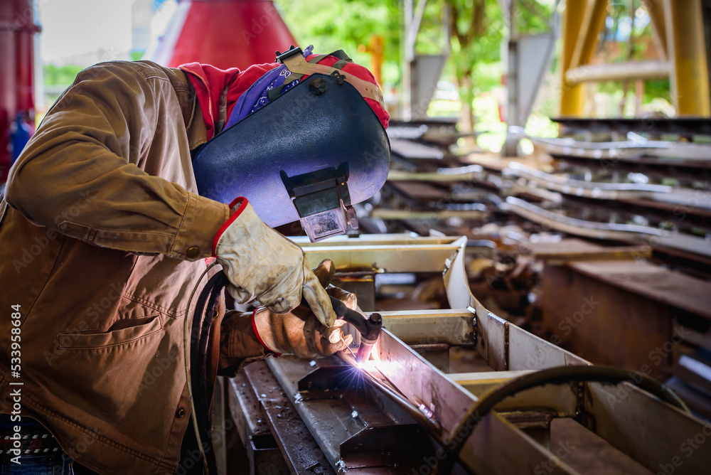 Industrial welder welding fabricated stainless construction work in ...