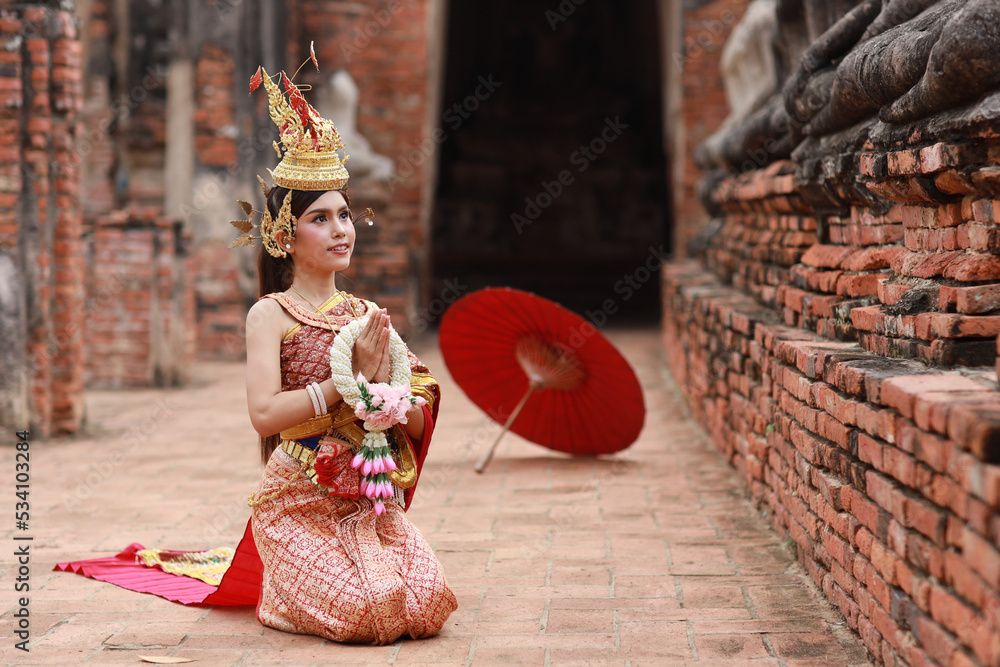 Young fashion and beautiful asian woman in red Thai traditional costume ...