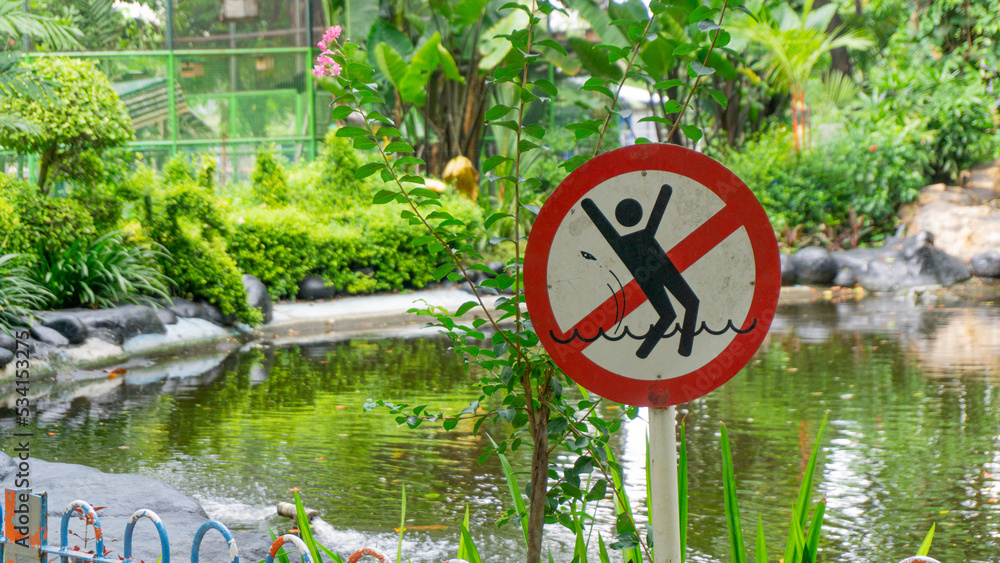 Beware of drowning sign. Forbidden to swim symbol. Deep water risk of ...