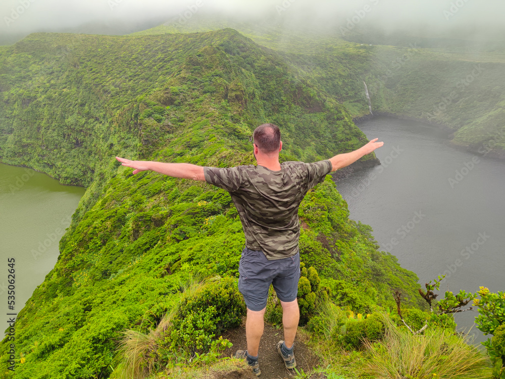 Twin volcano crater lakes at foggy day, Lagoa Negra (black lagoon) and ...