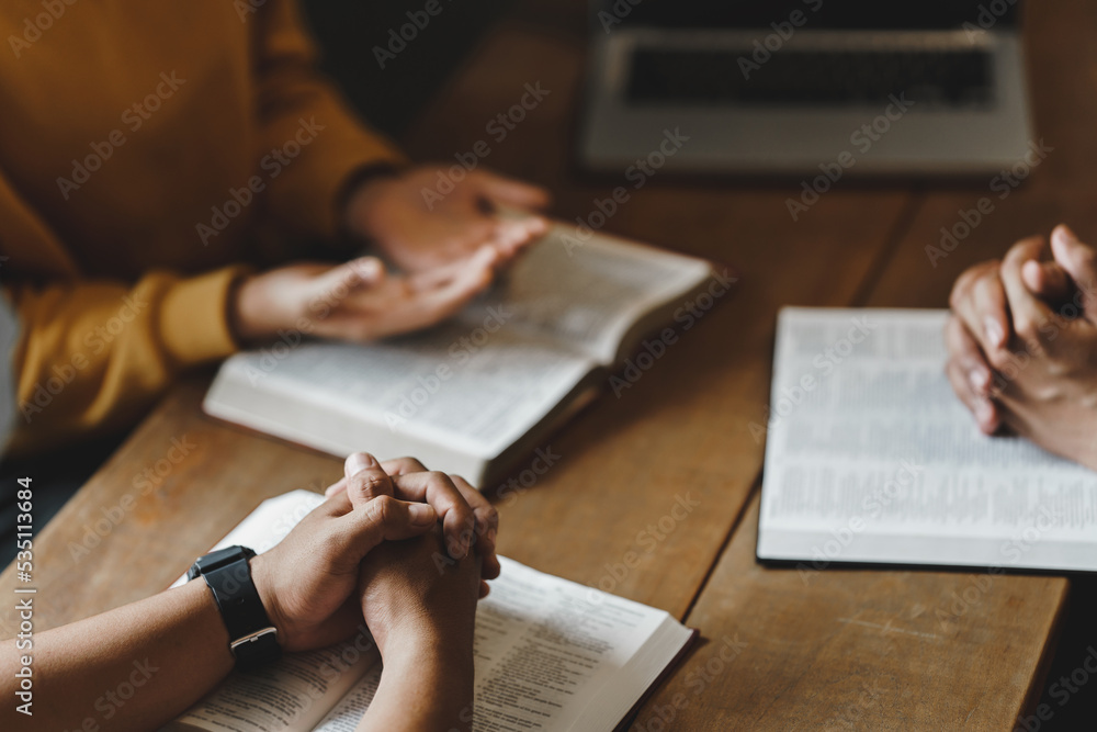 Christian group of people holding hands praying worship together to ...