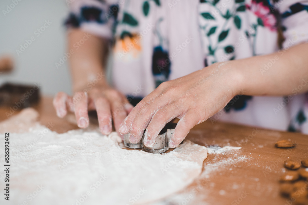 Cute kid girl making cake on kitchen table Stock Photo | Adobe Stock