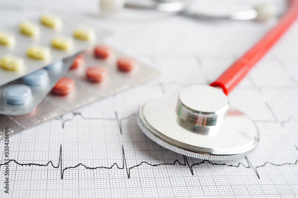 Stethoscope on electrocardiogram (ECG) with drug, heart wave, heart ...