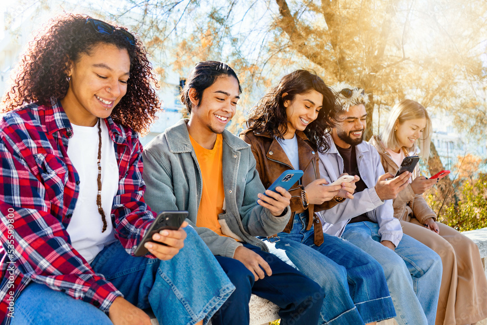 Foto de Stock Group of multiracial friends watching smart mobile phones ...