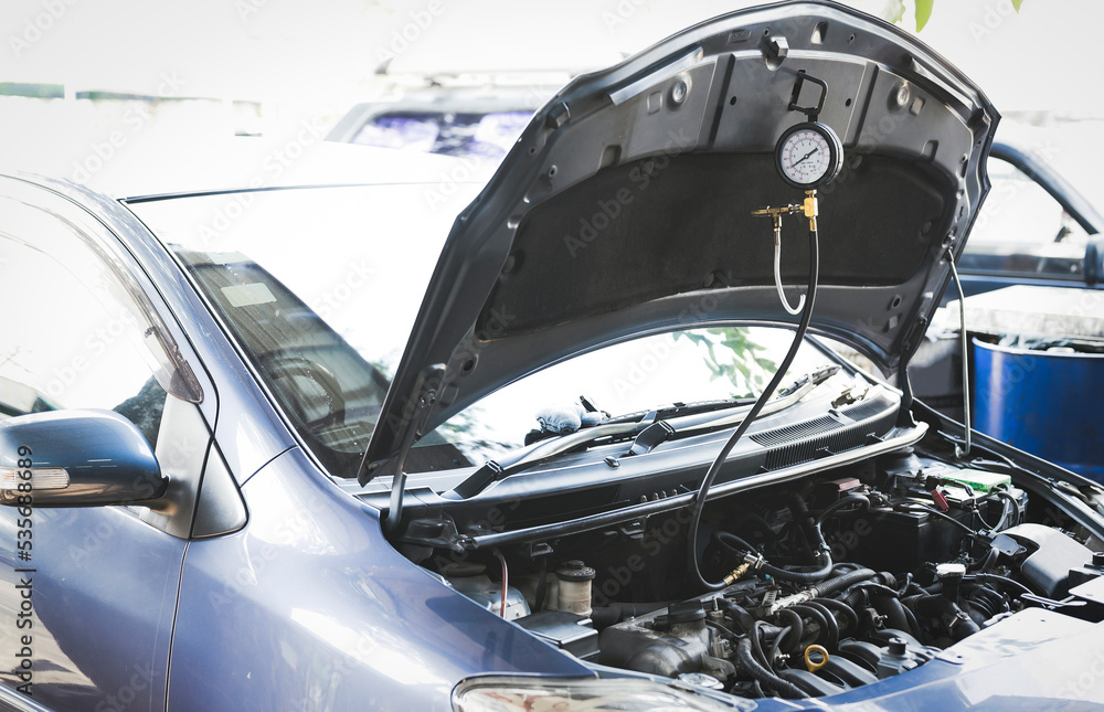 Car fuel system service ,check fuel pressure by using a fuel pressure ...