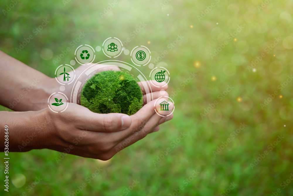 Hand of human holding green earth ESG icon for Environment Social and ...