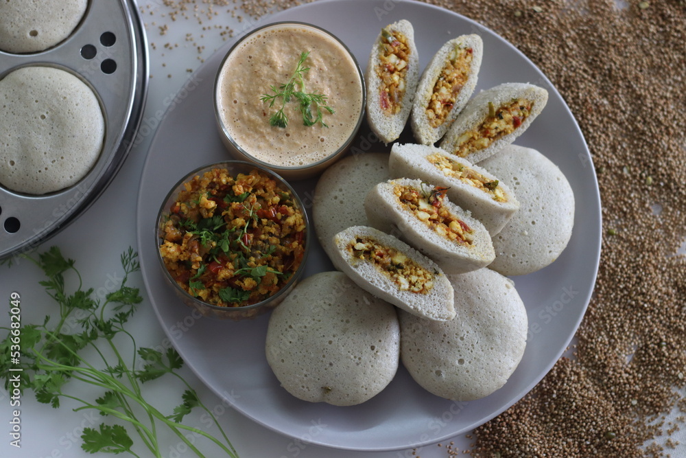 Paneer stuffed kodo millet Idly. Steamed savory cakes made of kodo ...
