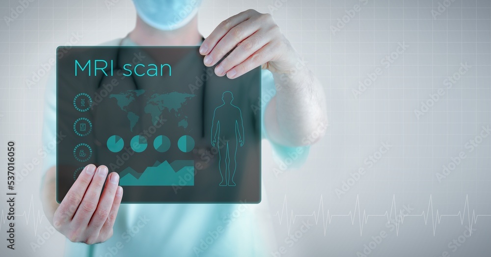 MRI scan (Magnetic resonance imaging). Doctor holding virtual letter ...