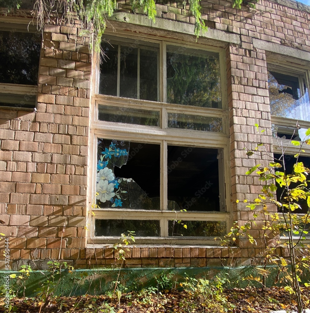 Broken window in a destroyed abandoned building Stock Photo | Adobe Stock