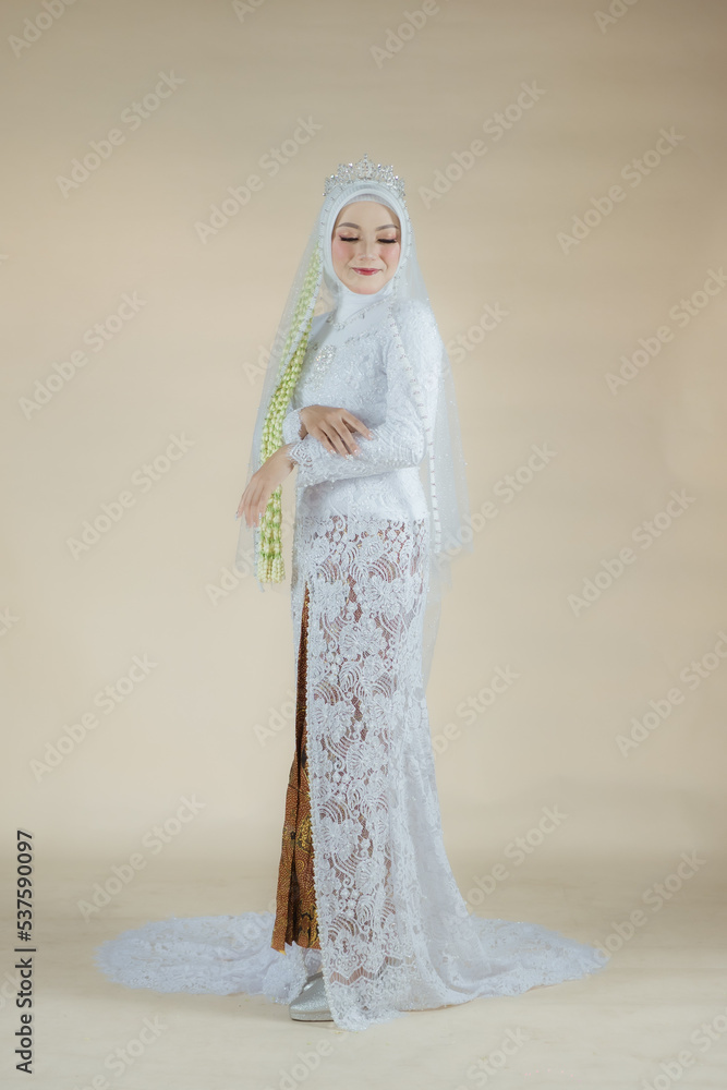 beautiful model, wearing hijab, Javanese Indonesian wedding dress in an ...
