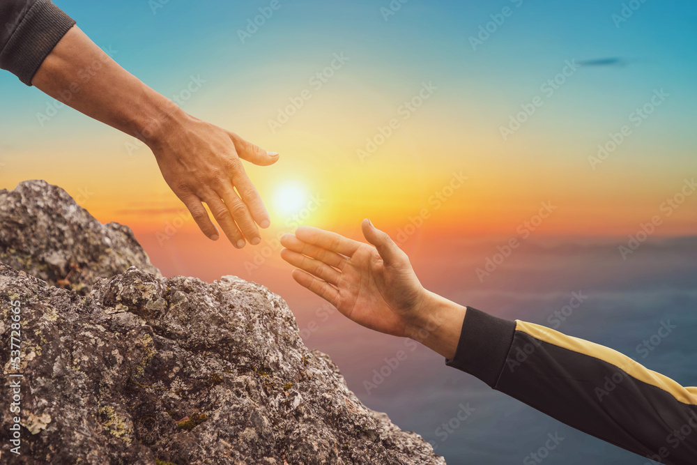 Helping hand concept and international day of peace.Lending a helping ...