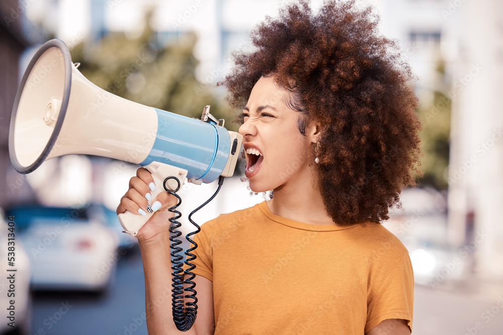 Angry, megaphone and black woman talking at a protest for human rights ...