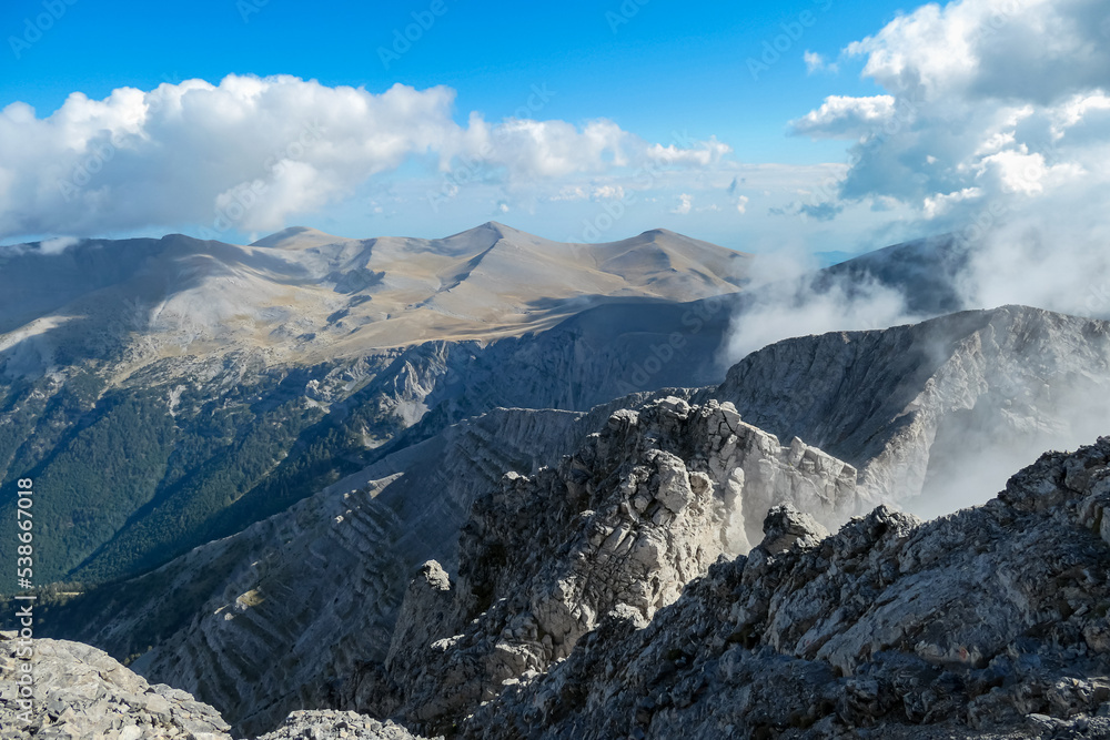 Panoramic view from cloud covered mountain summit of Mytikas Mount ...