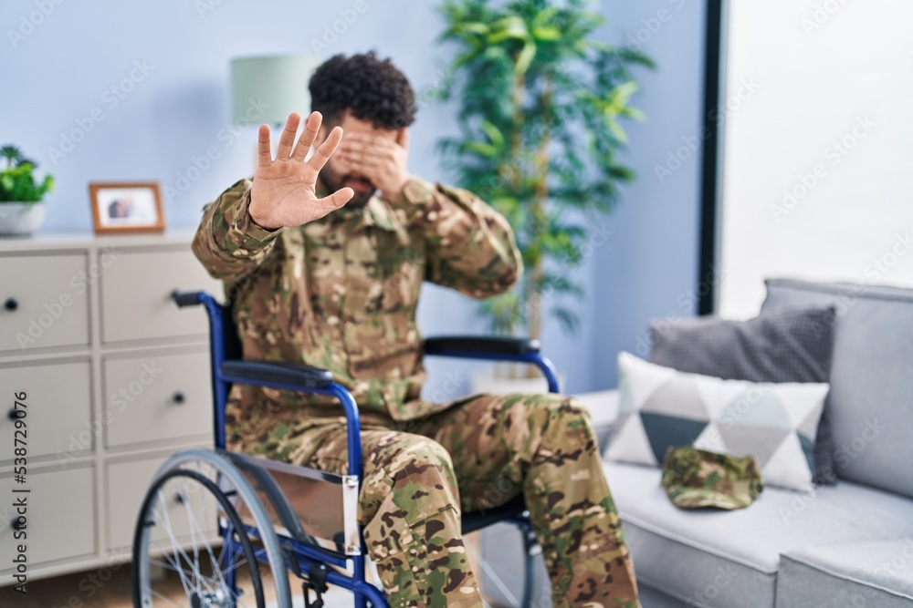 Photo Stock Arab man wearing camouflage army uniform sitting on ...