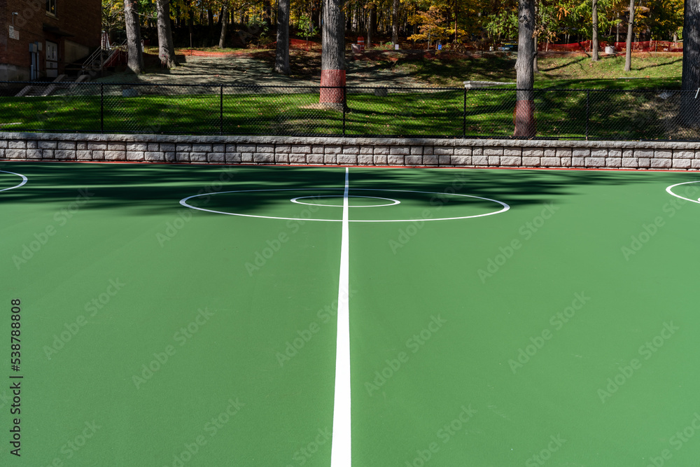 Interesting green and red outdoor basketball court at school playground ...
