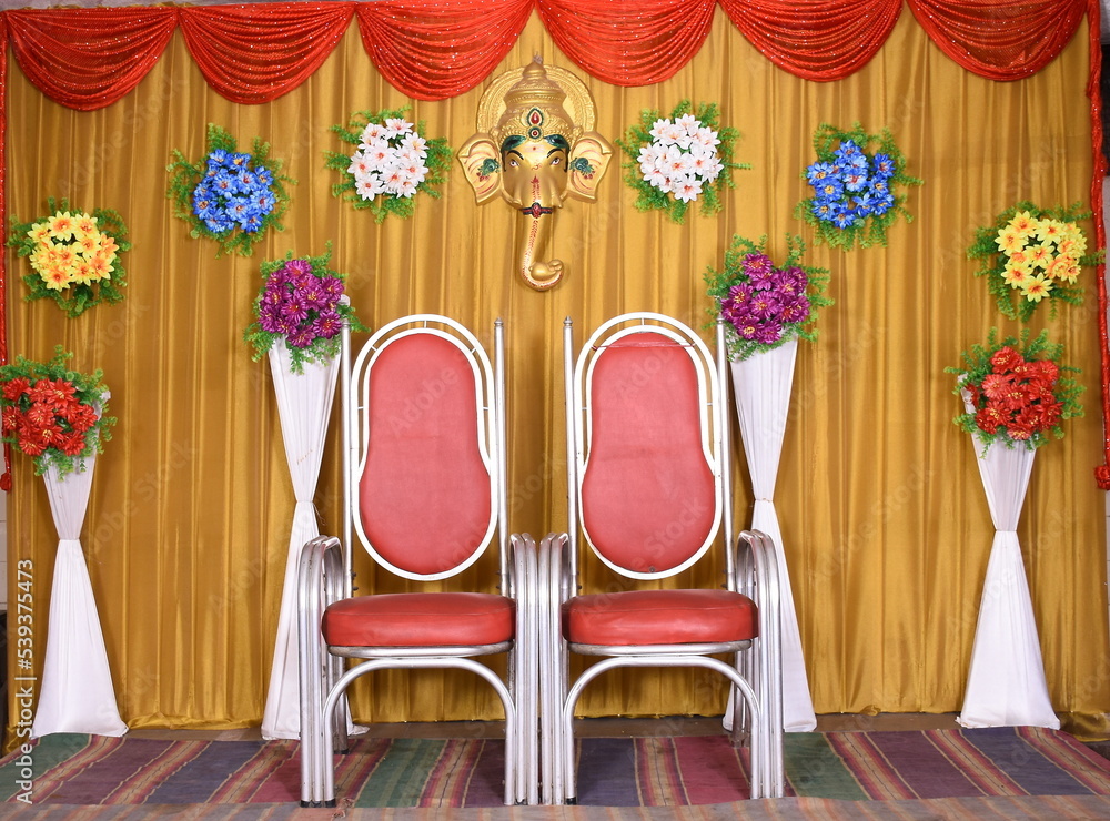 white theme stage decoration with yellow satin cloth in the background ...