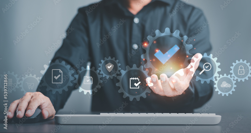 Foto Businessman showing a validation icon, a quality check approval ...