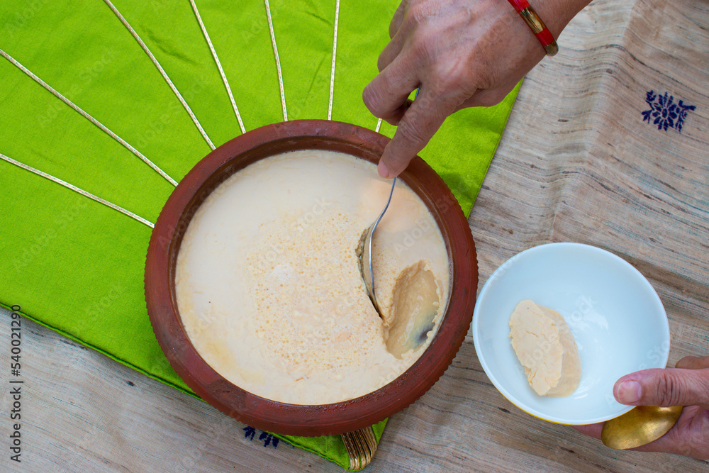 Homemade Mishti Doi or sweet dahi or curd made with milk and sugar or ...