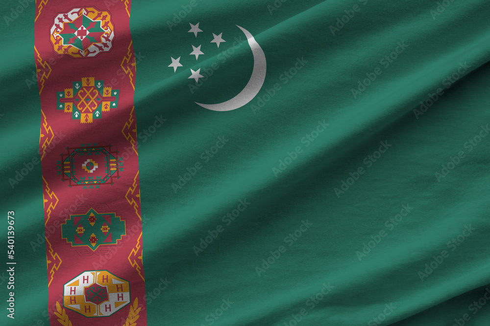 Turkmenistan flag with big folds waving close up under the studio light ...