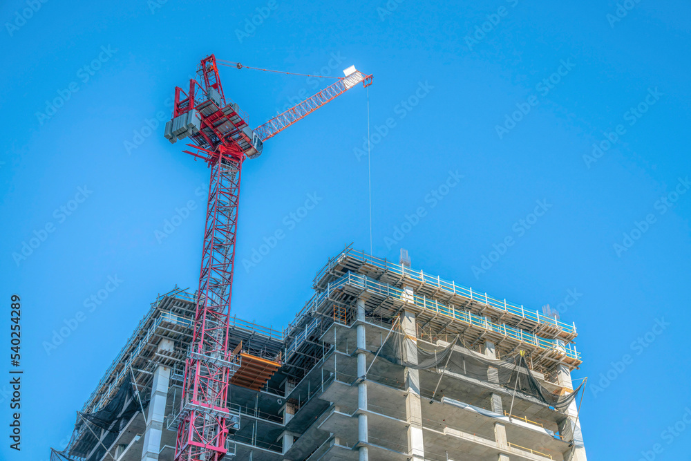 Austin, Texas- Under construction high-rise building with tower crane ...