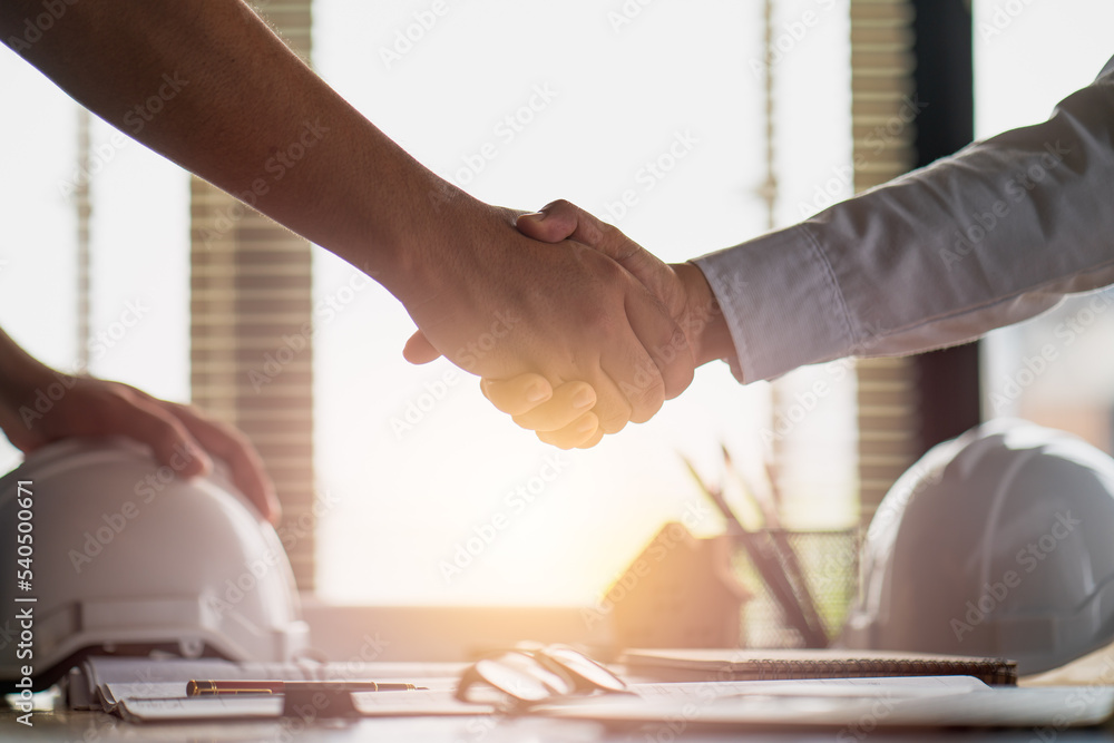 Engineer constructor handshake meeting with architect owner for ...