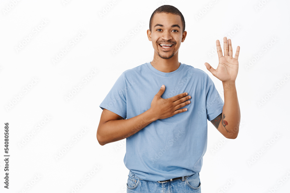 Friendly nice guy raising hand, greeting, introducing himself, waving ... Friendly nice guy raising hand, greeting, introducing himself, waving ...