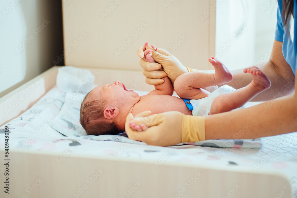 Photo Stock Adorable newborn baby 3 day old girl in diaper check up ...