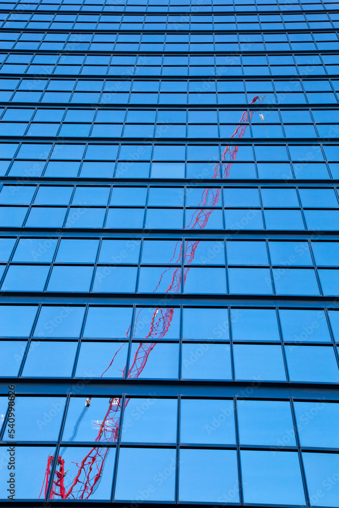 Reflection of crane on modern office building Stock Photo | Adobe Stock