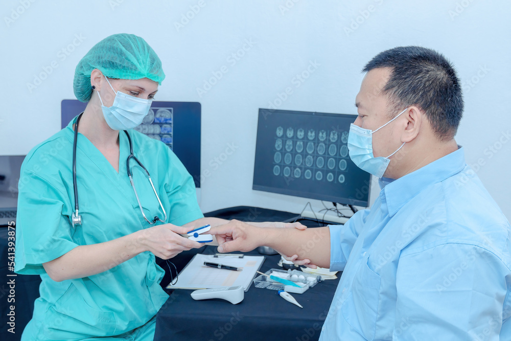 Doctor checking oxygenation with fingertip pulse oximeter. Saturation ...
