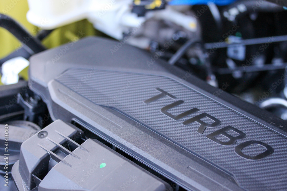 Plastic engine cover with Turbo lettering Stock Photo | Adobe Stock