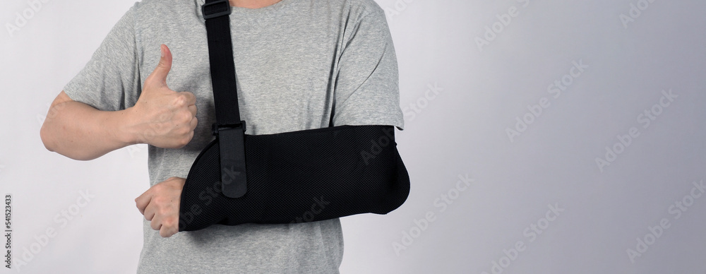 Broken arm. Arm Sling therapy support and covered around elbow first ...