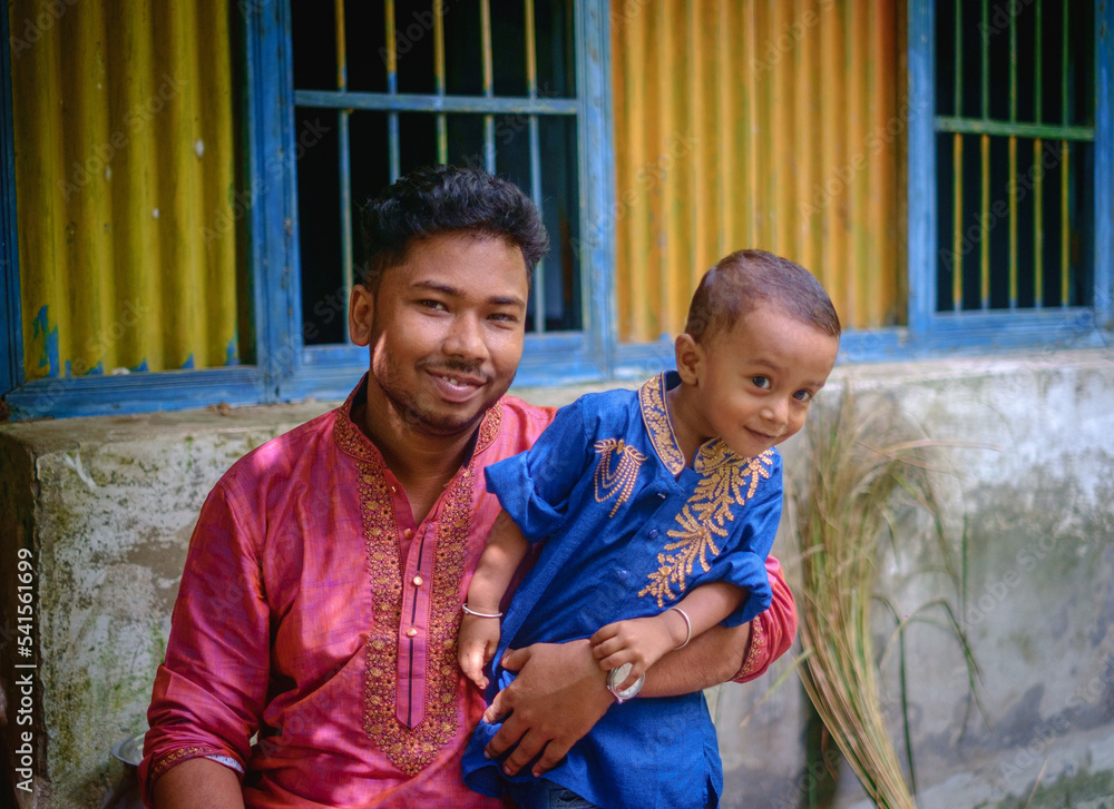 South asian hindu religious young father with his little son Stock ...