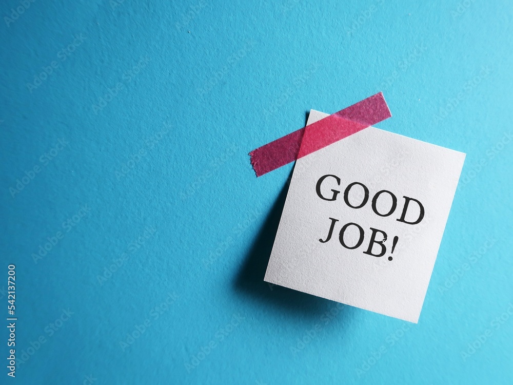 Note stick on blue copy space background with text GOOD JOB!, concept ...
