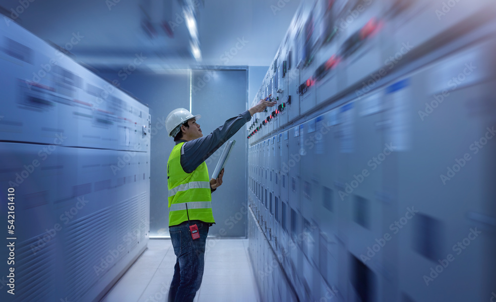 The engineer checking and inspecting at MDB panel .he working with ...