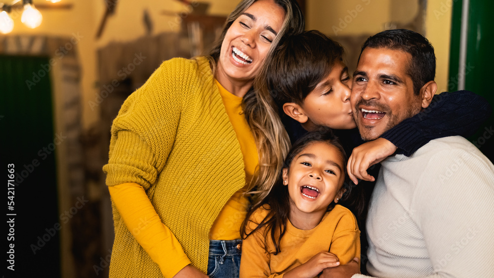 Happy Hispanic family having fun together Stock Photo | Adobe Stock