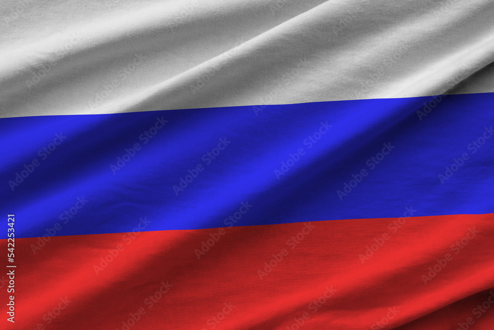Russia flag with big folds waving close up under the studio light ...