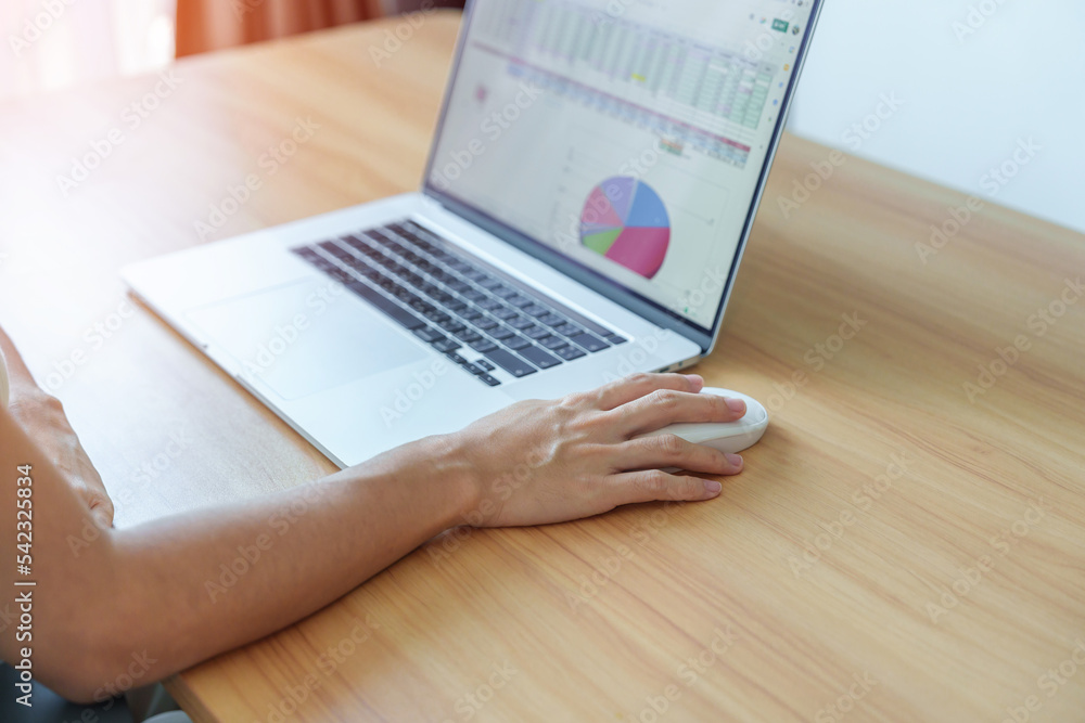 Woman using mouse and laptop computer during working long time on ...