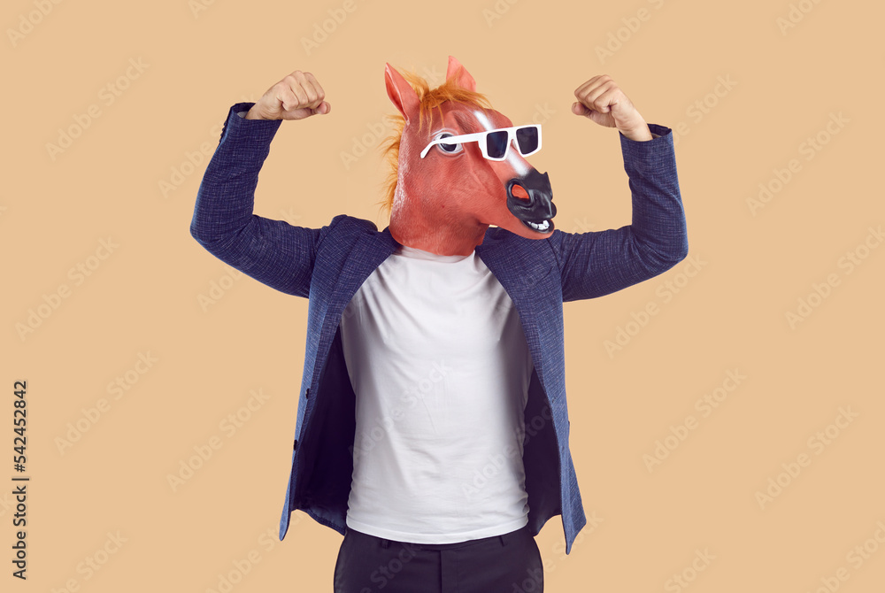 Stock-Foto „Eccentric man in funny weird costume showing his strong ...
