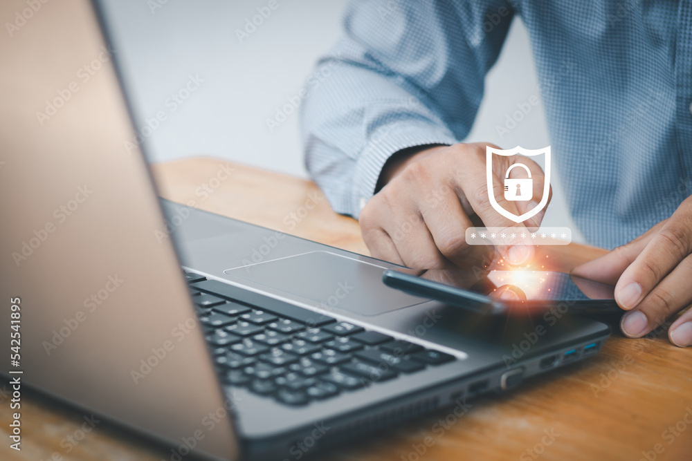 Two factor authentication concept. Virtual safety shield icon while access on phone with laptop ...