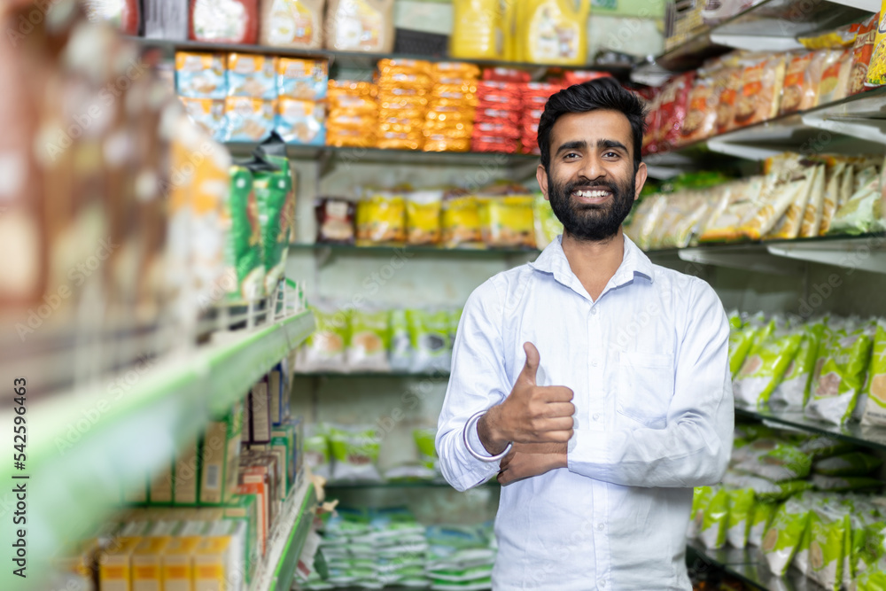 Indian shop keeper in Grocery store showing thumbs up Stock Photo ...