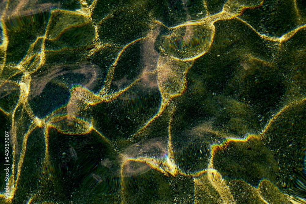 Reflection on the seabed of the refraction of the sun's rays in sea ...