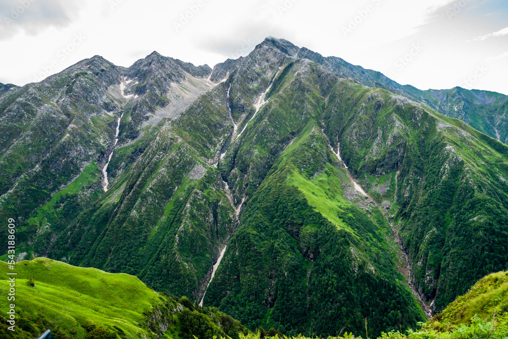 Beautiful mountains peaks and waterfalls in the background. Shrikhand ...
