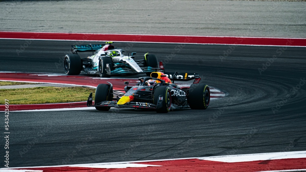 Competition between racing cars of Lewis Hamilton and Max Verstappen on ...