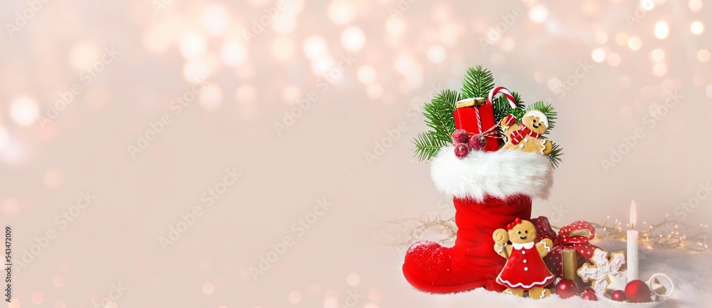 Santa Claus boot with gift box, candy cane and gingerbread man ...