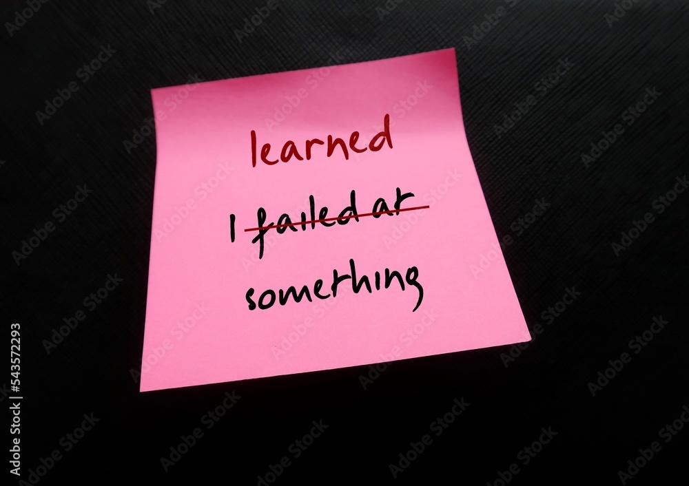 Pink note on black background with handwritten text I FAILED AT ...