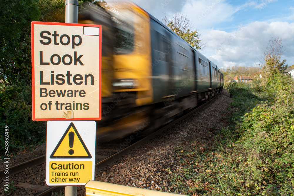 Train level crossing safety sign. Stop Look Listen warning sign ...