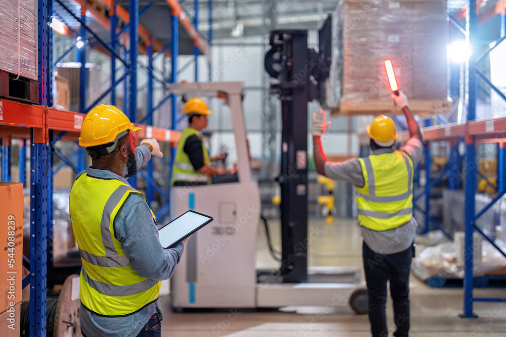 African american working in warehouse hold red light give signal to ...