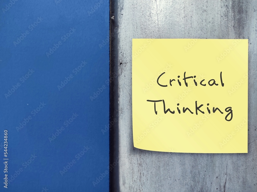 Blue wall with handwritten sticky note CRITICAL THINKING - Ability to ...