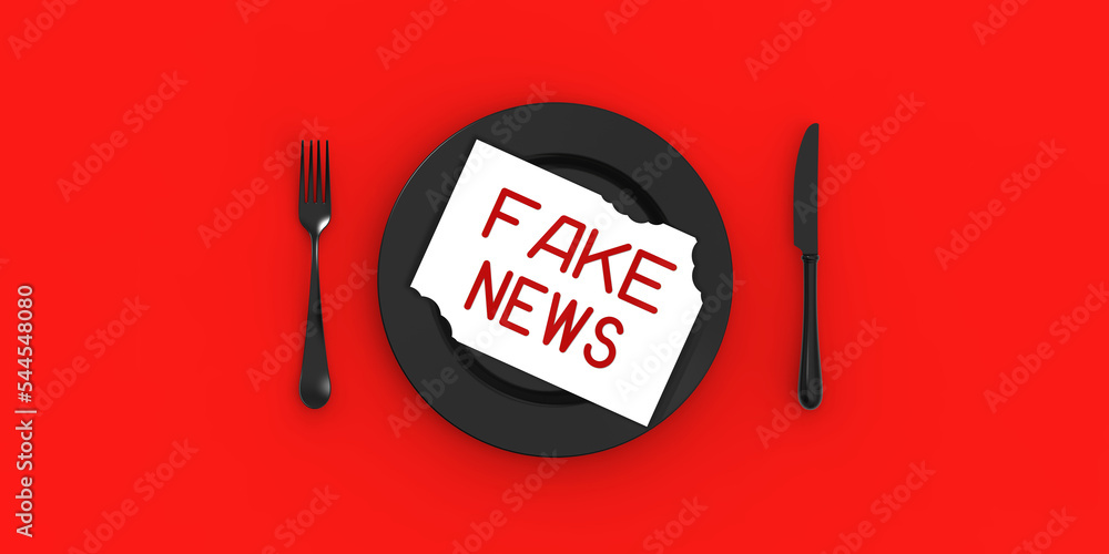 The inscription fake news on a bitten sheet of paper. Absorption of ...